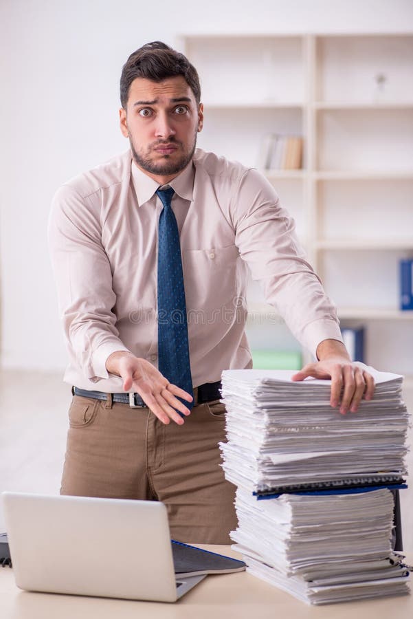 Young Male Employee Unhappy with Excessive Work in the Office Stock ...