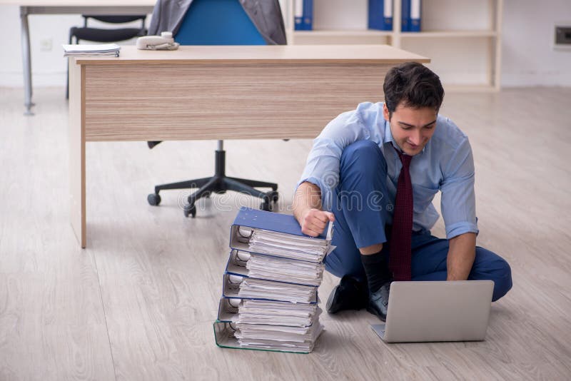 Young Male Employee Unhappy with Excessive Work in the Office Stock ...