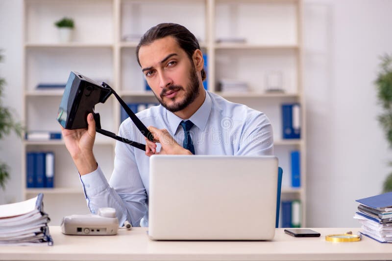 Young Male Employee Wearing Virtual Glasses at Workplace Stock Photo ...