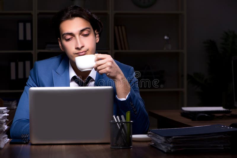 Young Male Employee Working Night in the Office Stock Image - Image of ... Young Male Employee Working Night in the Office Stock Image - Image of ...