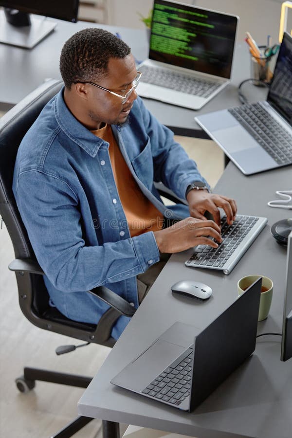 Young Male it Engineer in Glasses Using Computer Stock Photo - Image of ...