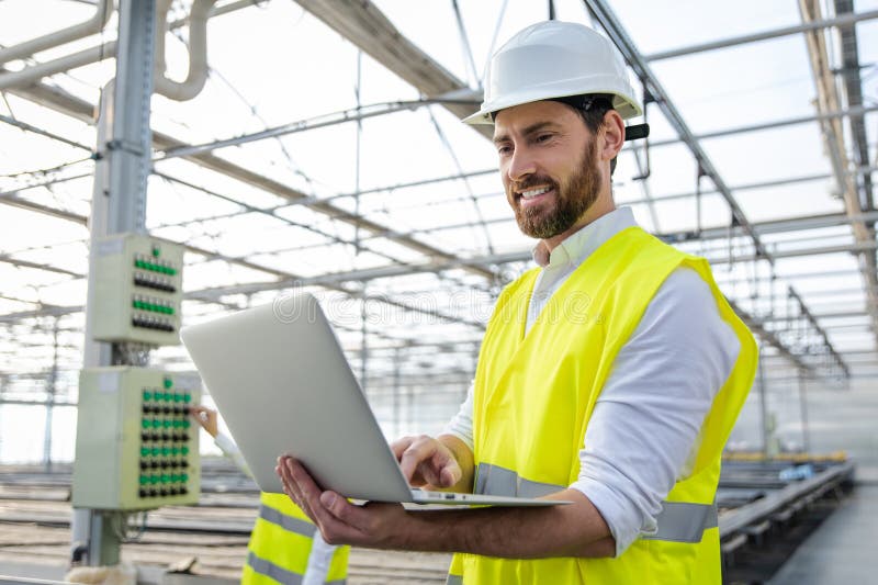 Young Male Engineer Laptop Checking Parameters Construction Site Stock ...