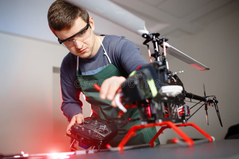 Young Male Engineer or Technician with Remote Control in His Hands ...