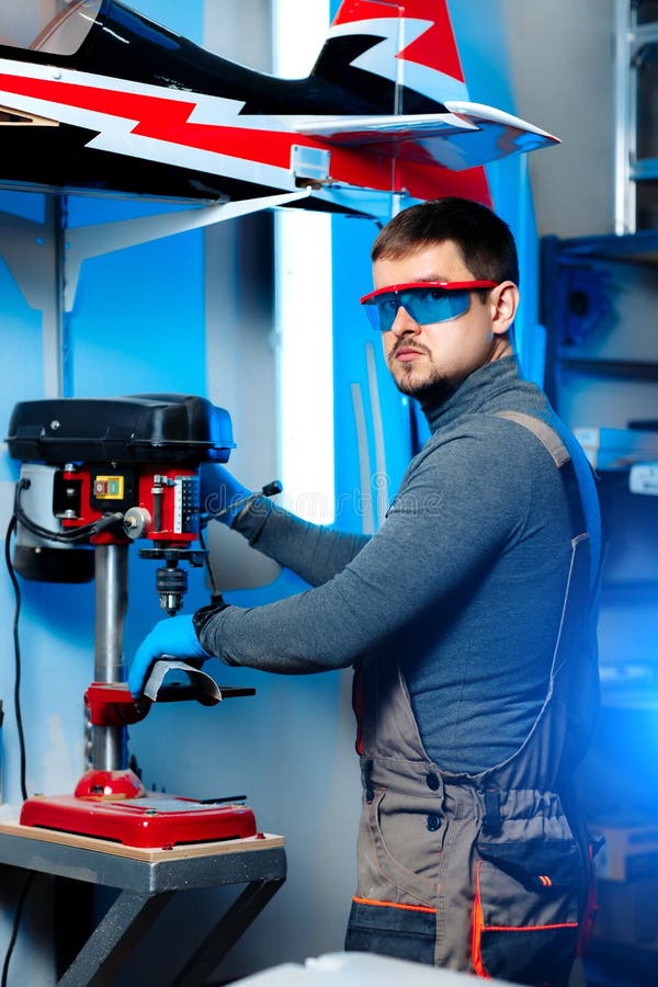Young Male Engineer or Technician Using Drill for Drone Details in Lab ...