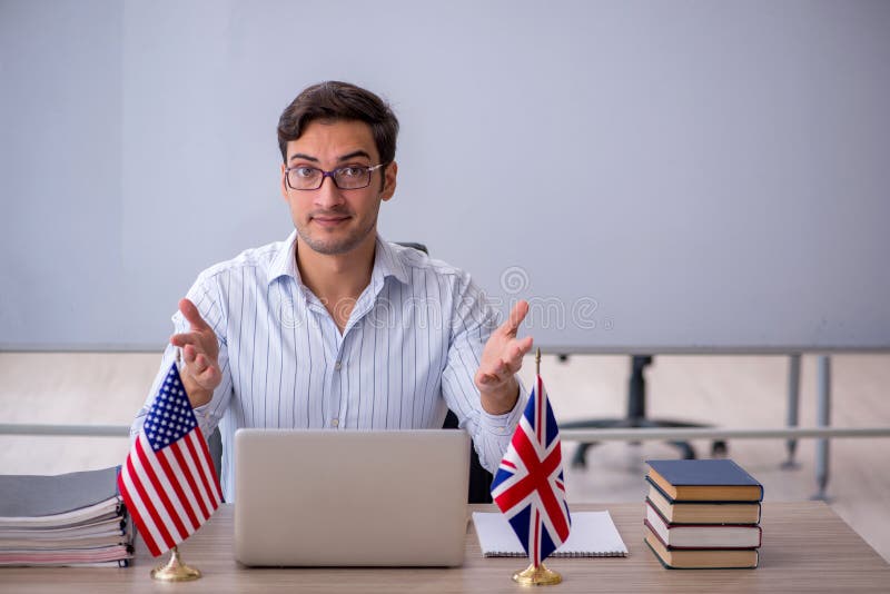 Young Male English Language Teacher in the Classroom Stock Photo ...
