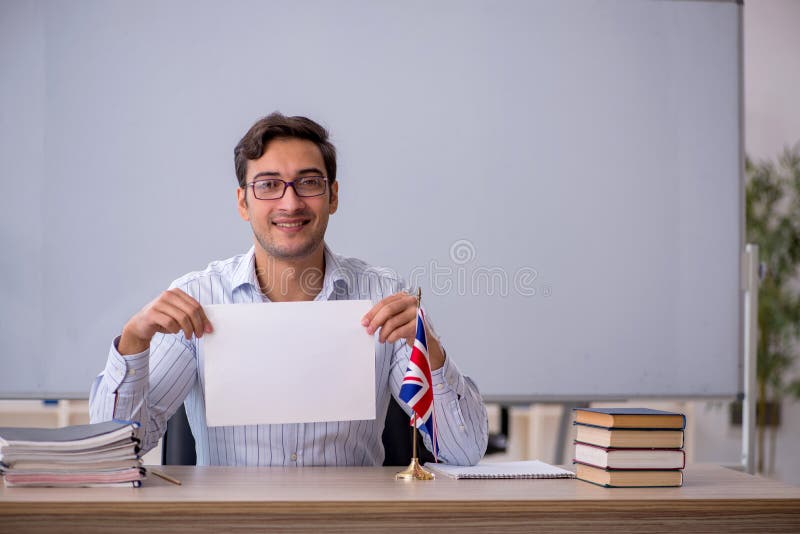 Young Male English Language Teacher in the Classroom Stock Photo ...