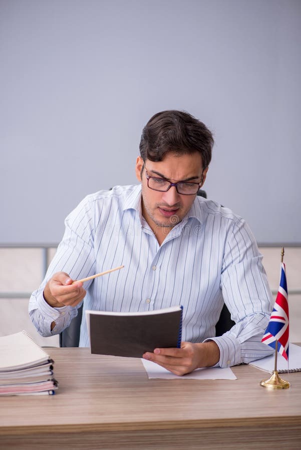 Young Male English Language Teacher in the Classroom Stock Photo ...