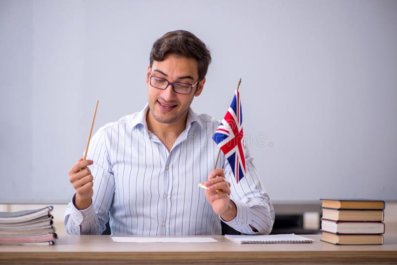 Young Male English Language Teacher in the Classroom Stock Photo ...