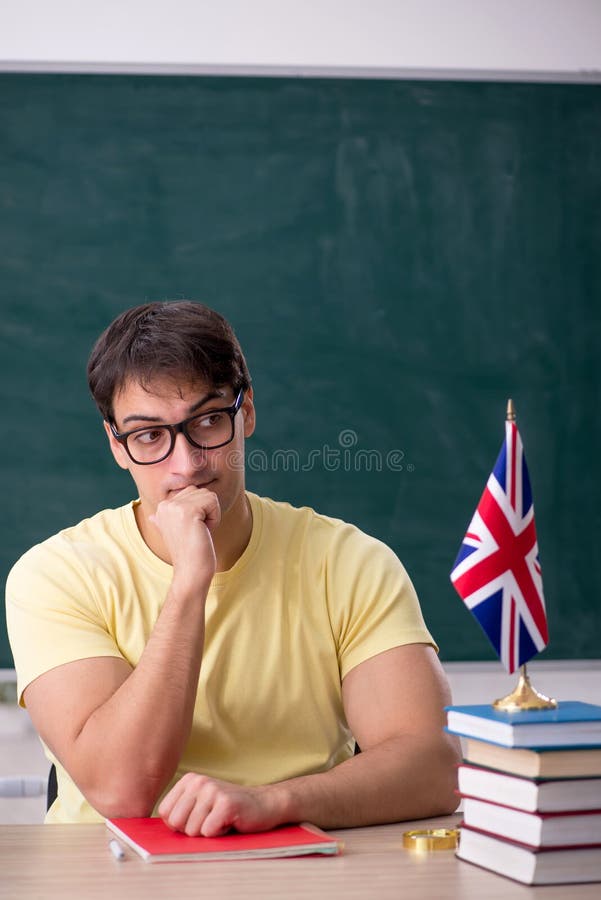 Young Male English Language Teacher in the Classroom Stock Photo ...