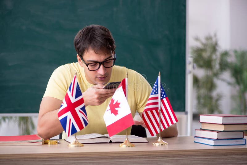 Young Male English Language Teacher in the Classroom Stock Photo ...