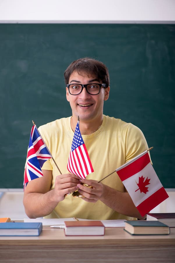 Young Male English Language Teacher in the Classroom Stock Photo ...