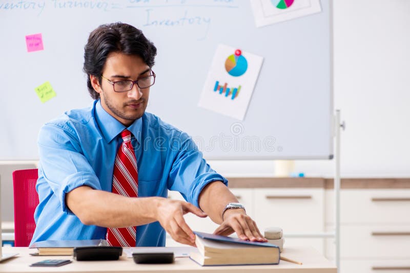 The Young Male Financial Manager Working in the Office Stock Photo ...