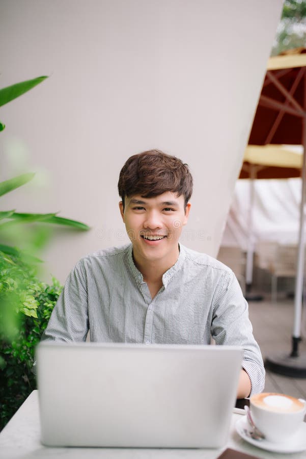 Young Male Freelancer Working With Laptop Computer In Comfortable