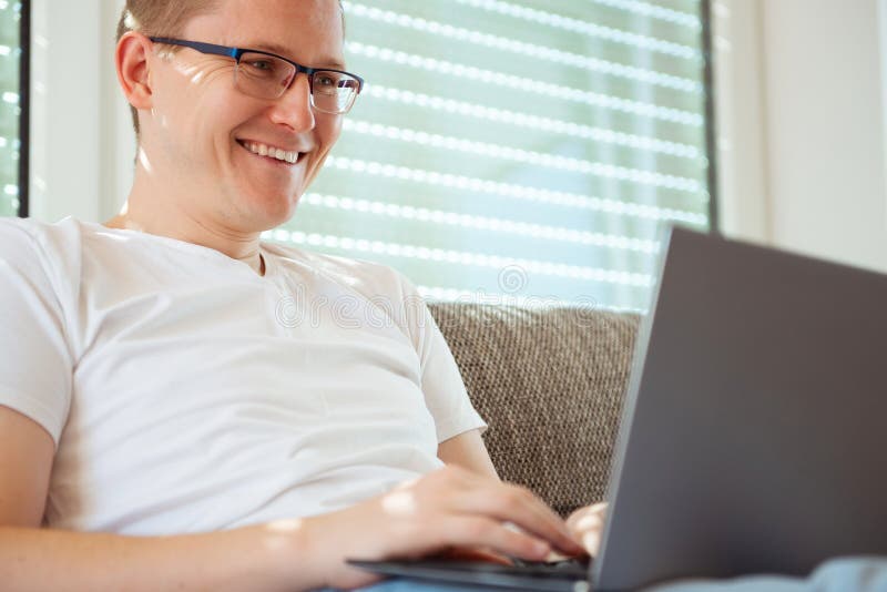Young Male Freelancer Working with Laptop at Home Stock Image - Image ...