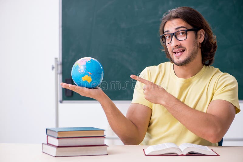 Young Male Geography Teacher in Front of Blackboard Stock Photo - Image ...