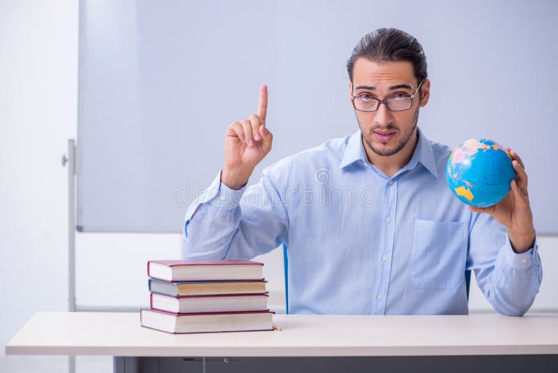 Young Male Geography Teacher in Front of Whiteboard Stock Photo - Image ...