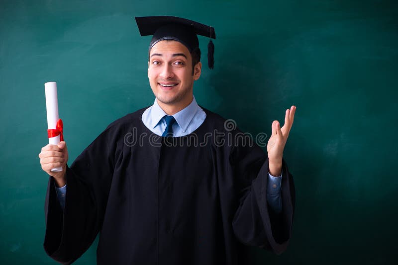 Young Male Graduate in Front of Board Stock Image - Image of joyful ...