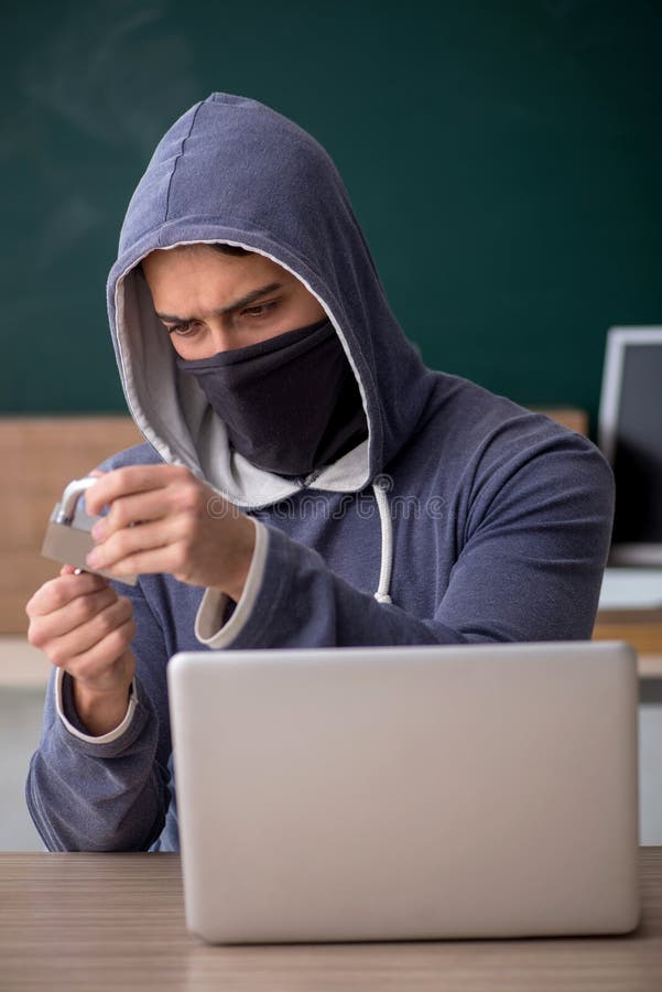 Young Male Hacker Sitting in the Classroom Stock Image - Image of ...
