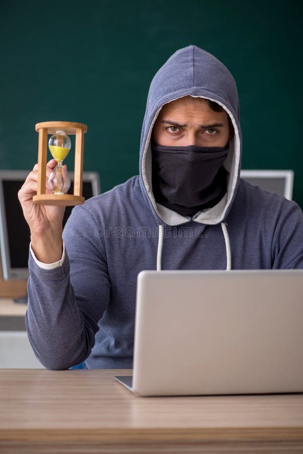 Young Male Hacker Sitting in the Classroom Stock Image - Image of hood ...