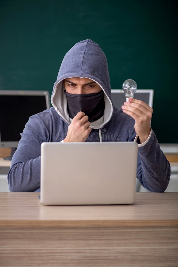 Young Male Hacker Sitting in the Classroom Stock Image - Image of ...