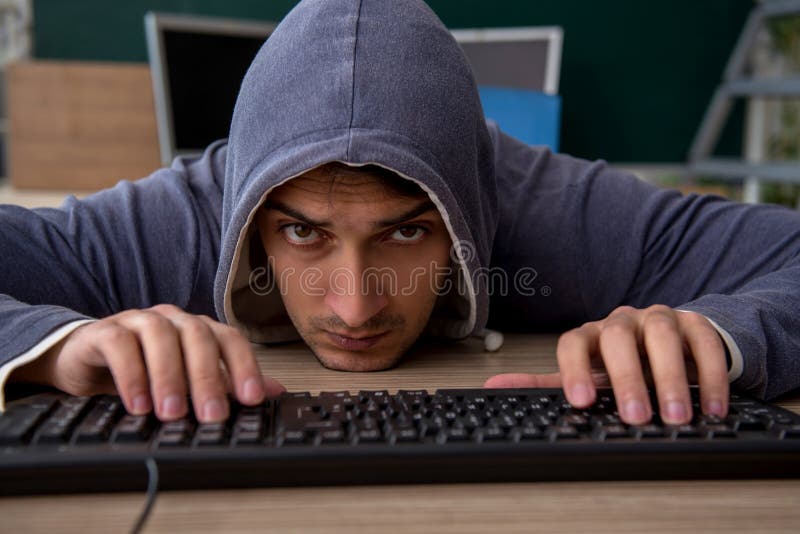 Young Male Hacker Sitting in the Classroom Stock Photo - Image of class ...