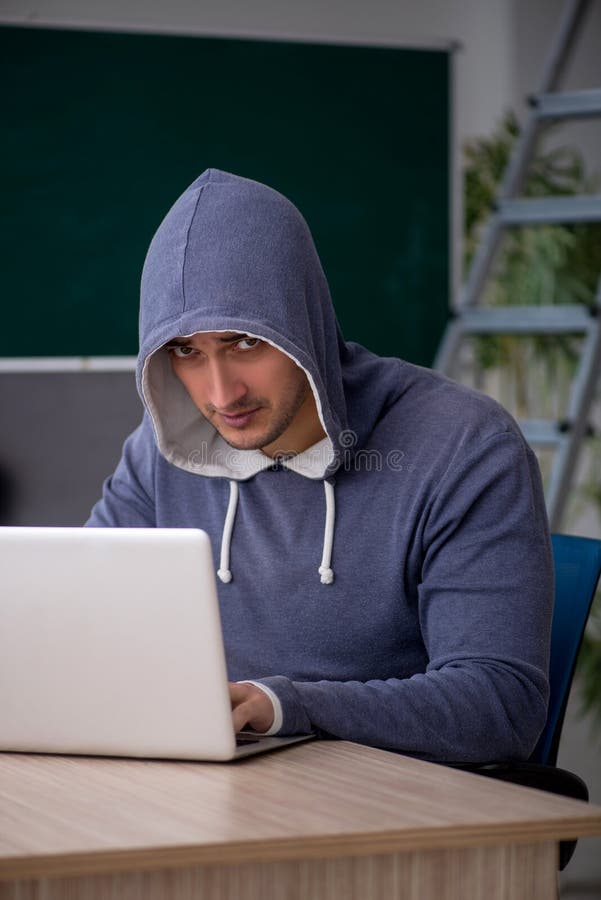 Young Male Hacker Sitting in the Classroom Stock Image - Image of ...