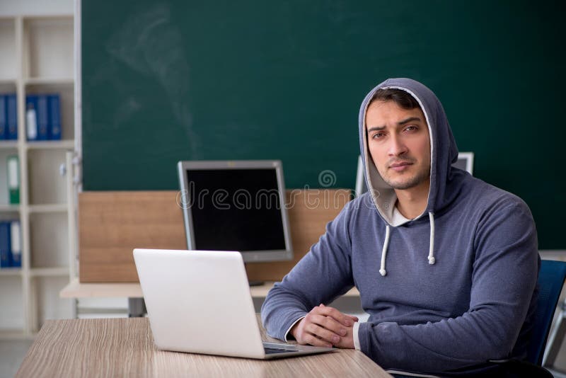 Young Male Hacker Sitting in the Classroom Stock Photo - Image of ...
