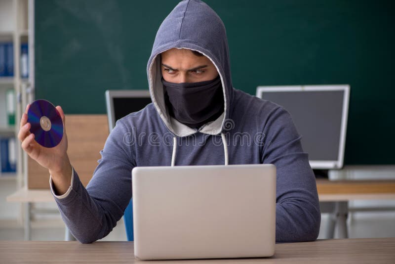 Young Male Hacker Sitting in the Classroom Stock Image - Image of ...