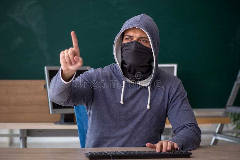 Young Male Hacker Sitting in the Classroom Stock Image - Image of ...