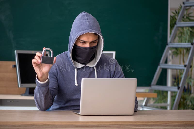 Young Male Hacker Sitting in the Classroom Stock Image - Image of ...