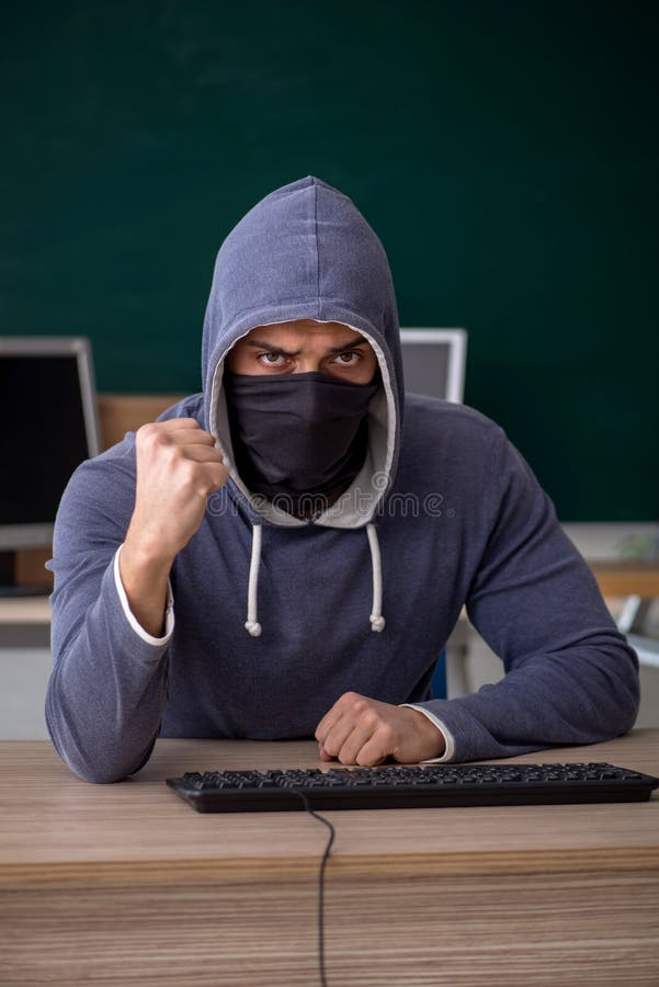 Young Male Hacker Sitting in the Classroom Stock Photo - Image of ...