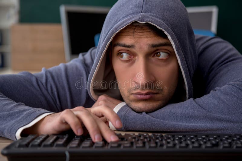 Young Male Hacker Sitting in the Classroom Stock Image - Image of ...