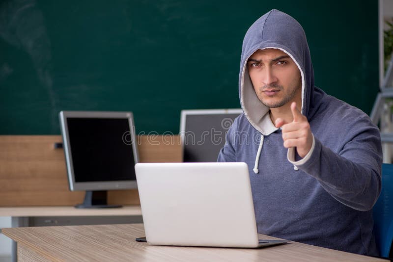 Young Male Hacker Sitting in the Classroom Stock Image - Image of ...