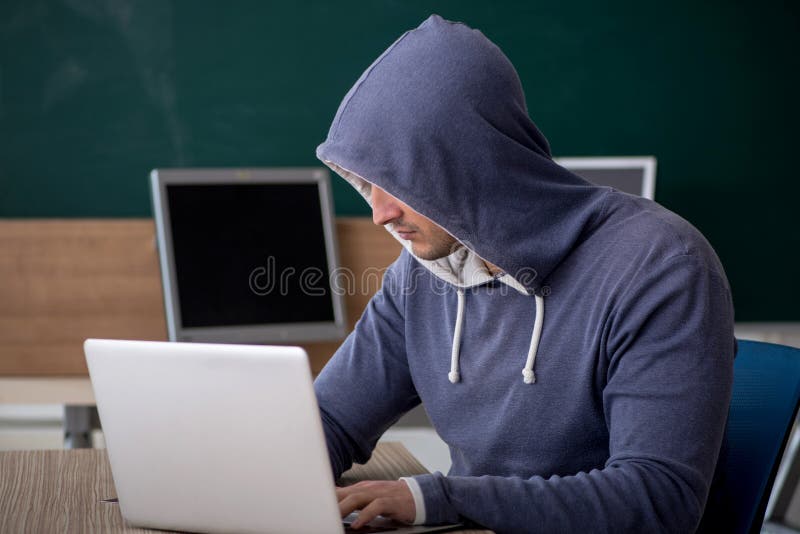 Young Male Hacker Sitting in the Classroom Stock Image - Image of class ...