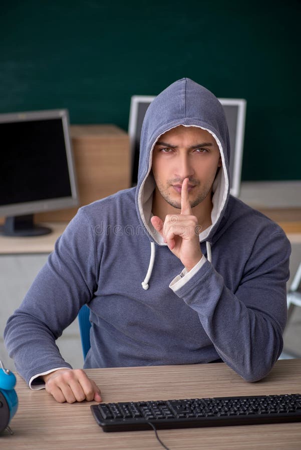 Young Male Hacker Sitting in the Classroom Stock Photo - Image of ...
