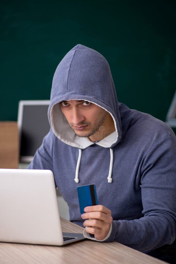 Young Male Hacker Sitting in the Classroom Stock Photo - Image of ...