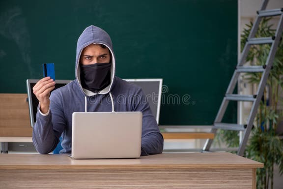 Young Male Hacker Sitting in the Classroom Stock Image - Image of ...