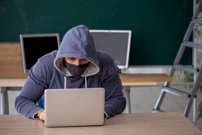 Young Male Hacker Sitting in the Classroom Stock Image - Image of ...