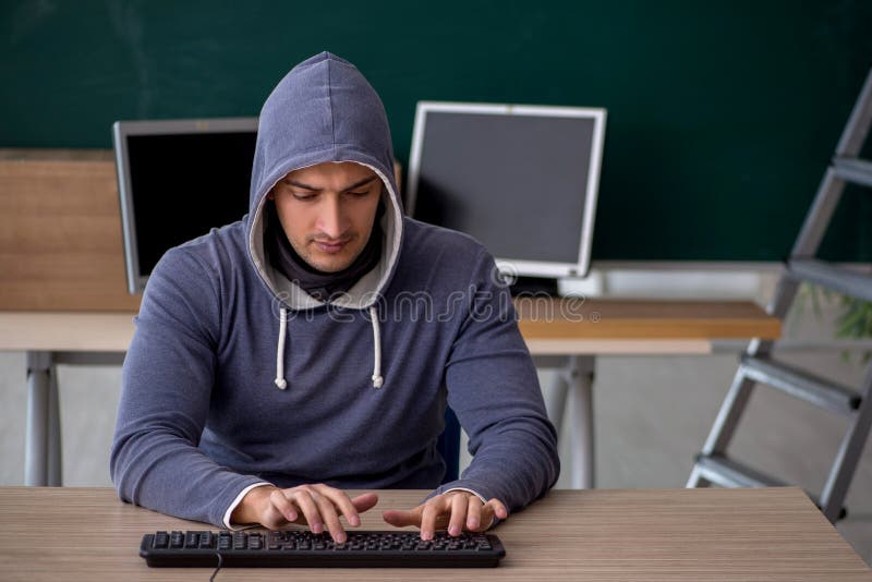 Young Male Hacker Sitting in the Classroom Stock Image - Image of ...