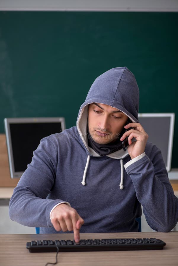 Young Male Hacker Sitting in the Classroom Stock Photo - Image of coder ...