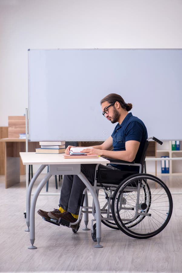 Young Male Handicapped Student in the Classroom Stock Photo - Image of ...