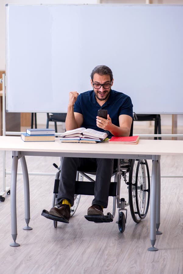 Young Male Handicapped Student in the Classroom Stock Photo - Image of ...