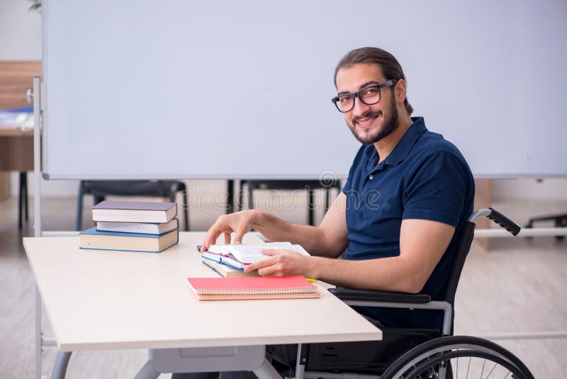 Young Male Handicapped Student in the Classroom Stock Image - Image of ...