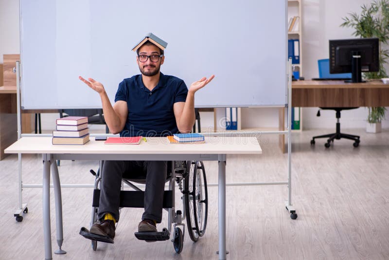 Young Male Handicapped Student in the Classroom Stock Photo - Image of ...