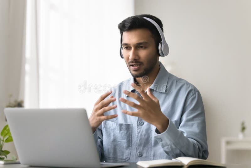 Young Male in Headset Talk by Videocall Using Notebook Webcam Stock ...
