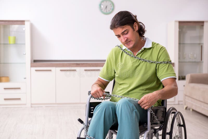 Young Male Invalid in Wheel-chair Suffering at Home Stock Image - Image ...