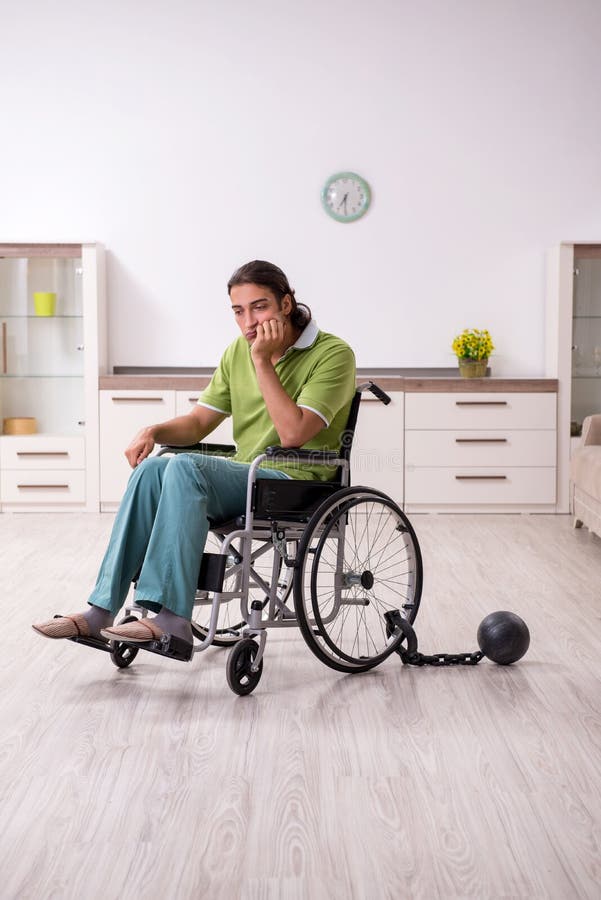 Young Male Invalid in Wheel-chair Suffering at Home Stock Photo - Image ...