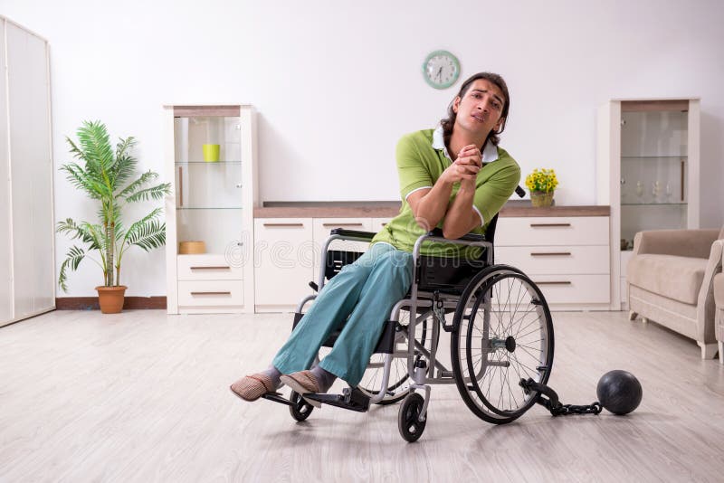 Young Male Invalid in Wheel-chair Suffering at Home Stock Image - Image ...