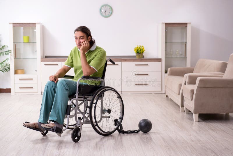 Young Male Invalid in Wheel-chair Suffering at Home Stock Photo - Image ...