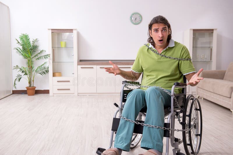 Young Male Invalid in Wheel-chair Suffering at Home Stock Photo - Image ...